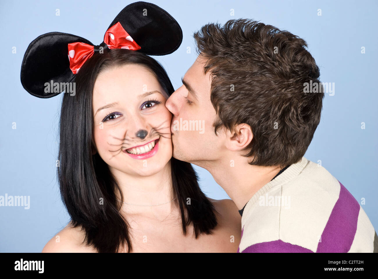 Happy mouse girl kissed by a man and smiling for you Stock Photo - Alamy