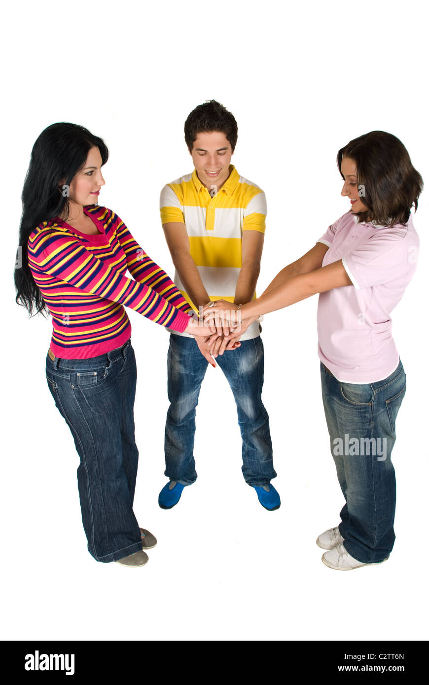 Three happy friends showing unity and put their hands together Stock ...