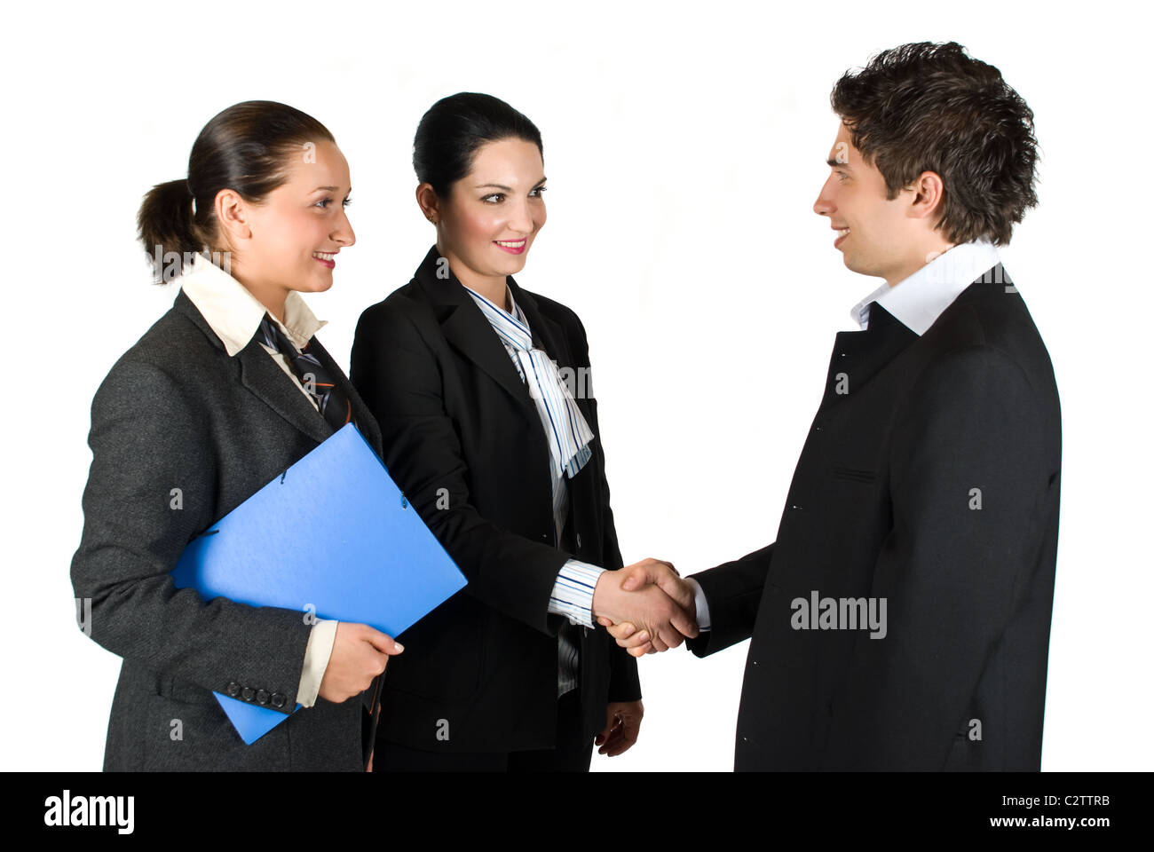 Three business people successful give handshake at meeting ,one of the ...