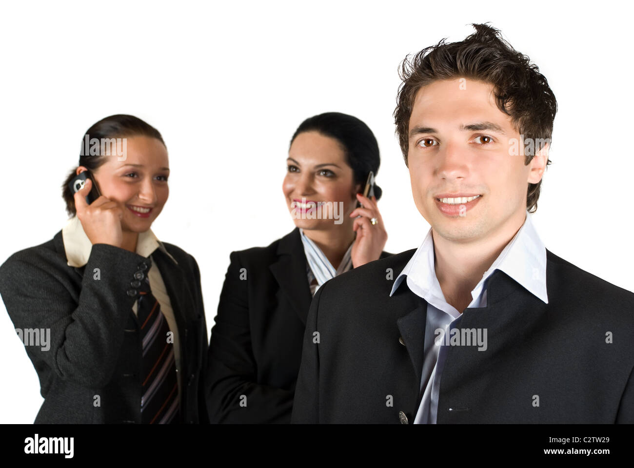Three business people team with two businesswoman talking at phone ...