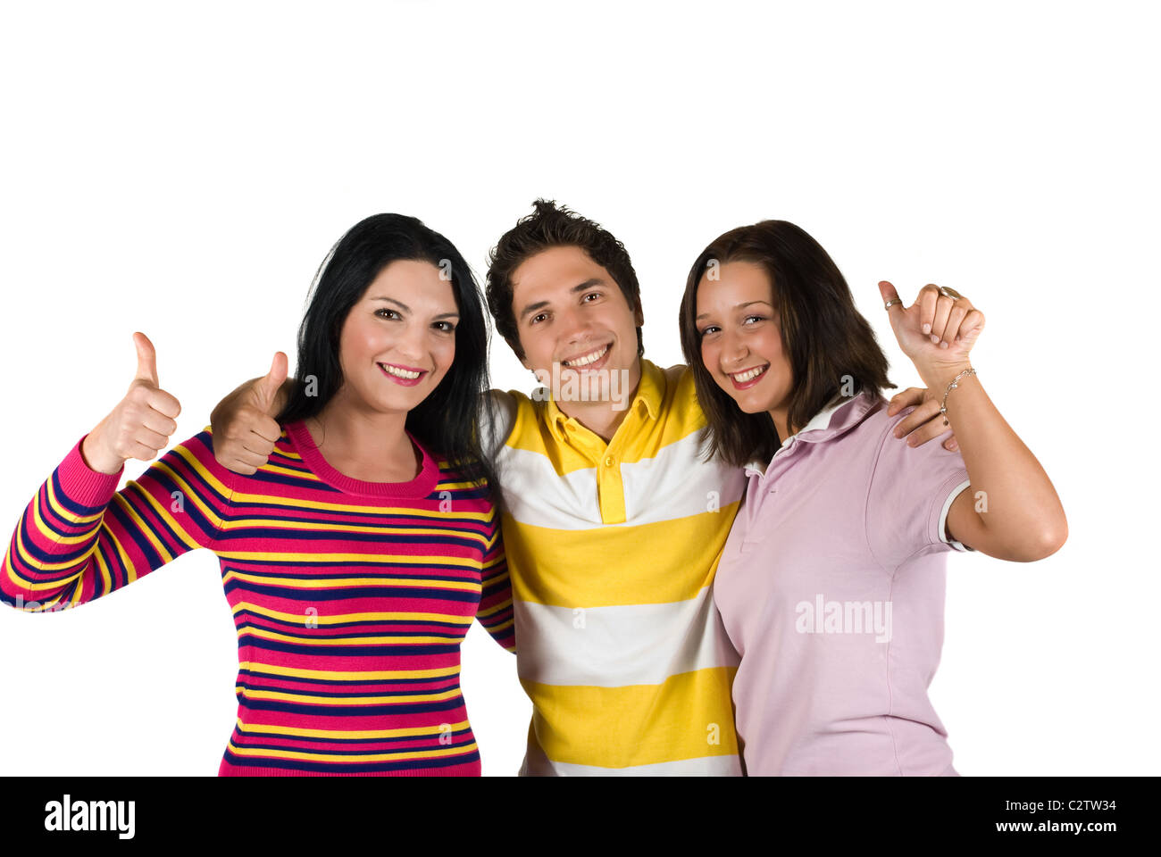 Three young happy friends giving thumbs-up sign and showing happiness ...