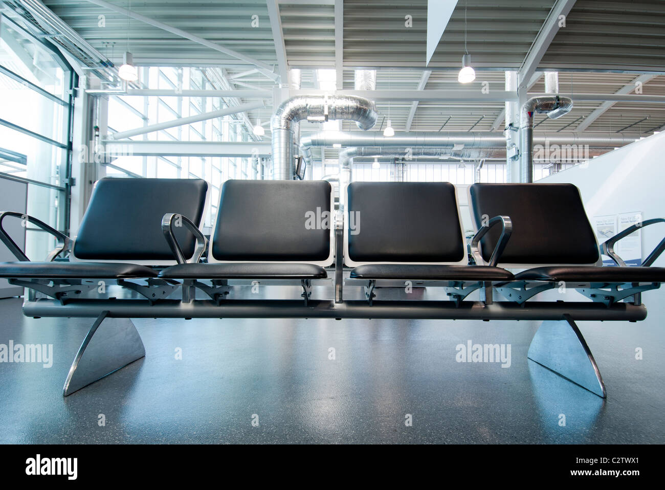 modern airport bench seating Stock Photo - Alamy