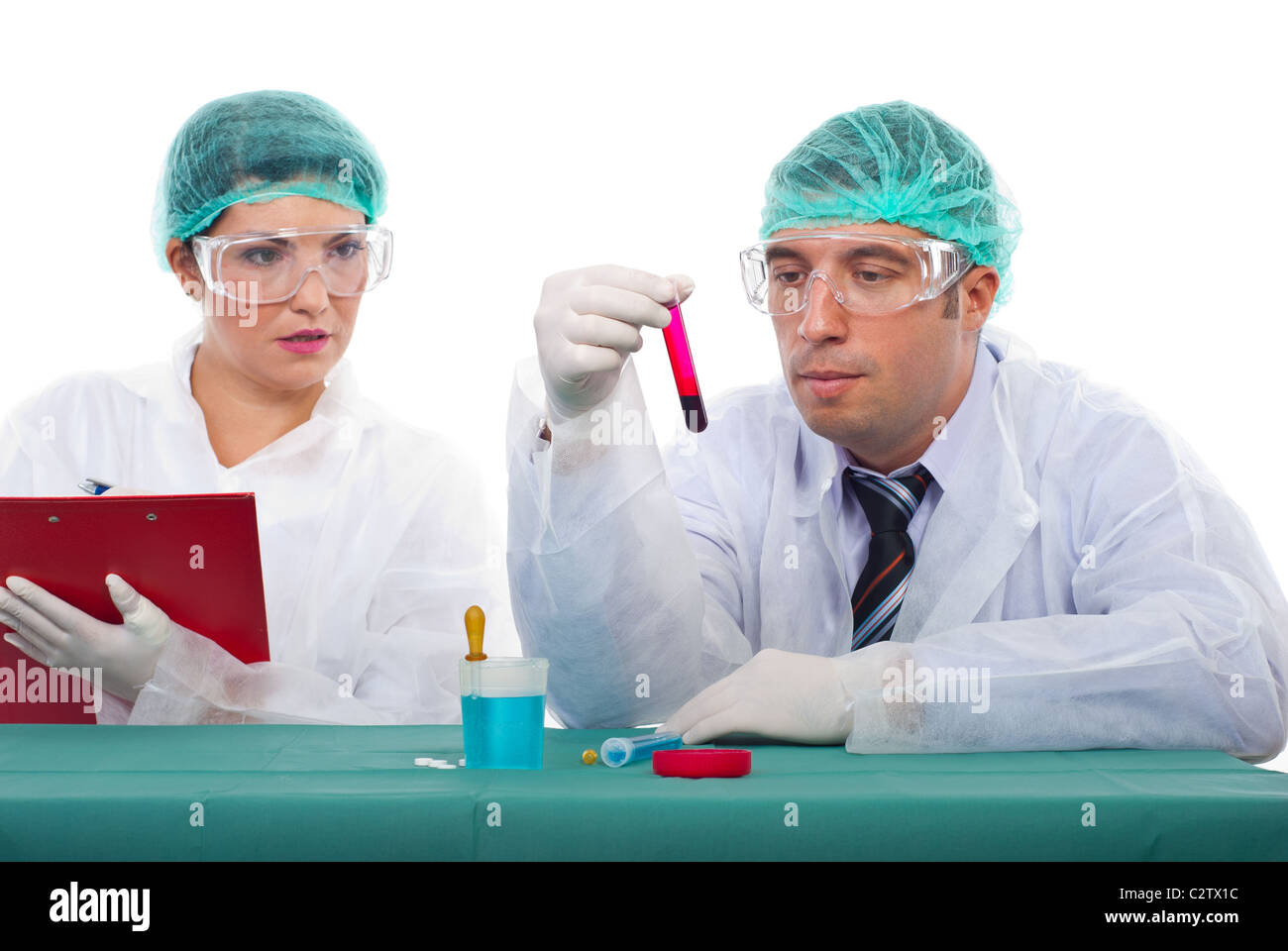 Two scientists working in laboratory,man examine blood tube and woman ...