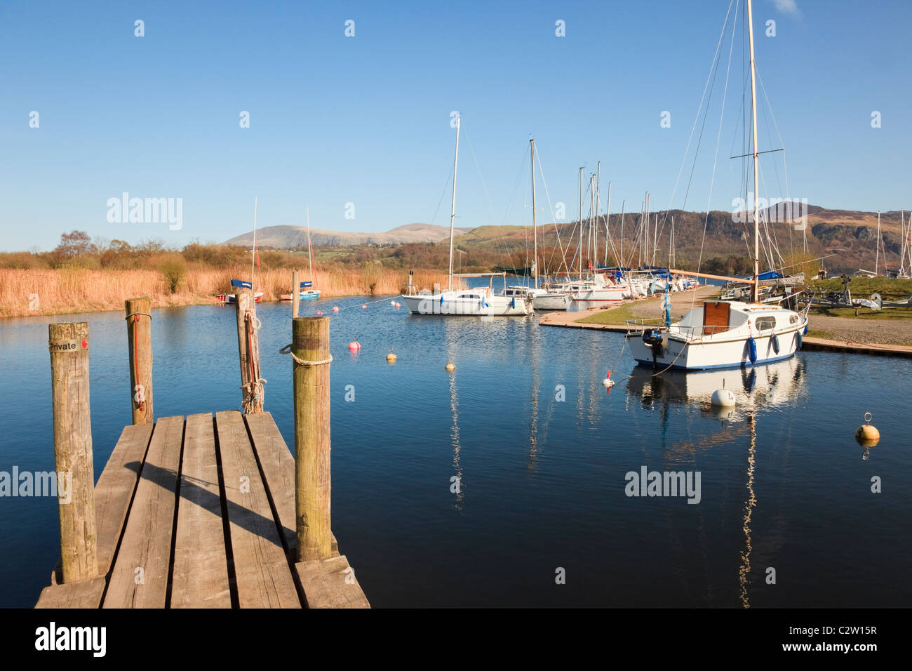 Portinscale, Keswick, Cumbria, England, UK. Wooden jetty moored boats ...