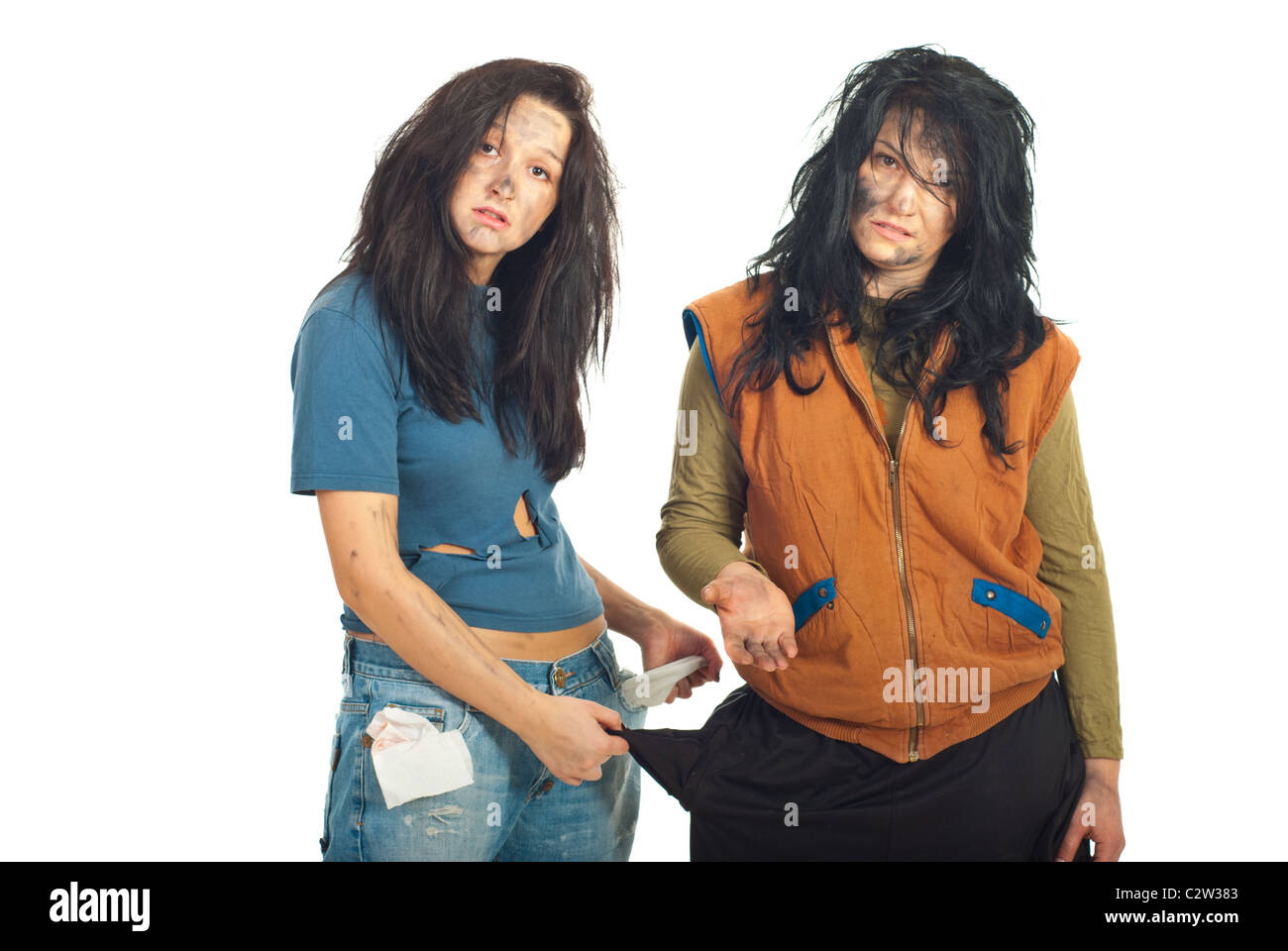 Two young beggars women begging for food isolated on white background ...
