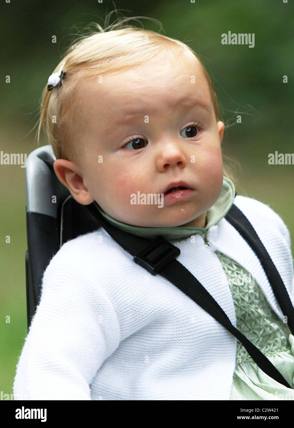 Princess Ariane rides on a bicycle with her parents on their country ...