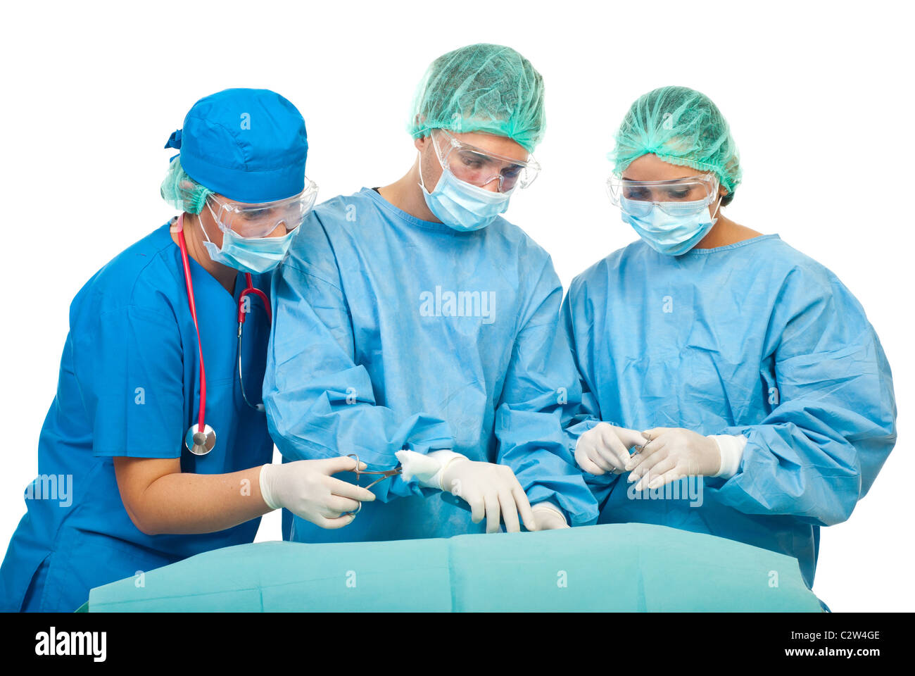 Three busy surgeons operating in operation room Stock Photo - Alamy