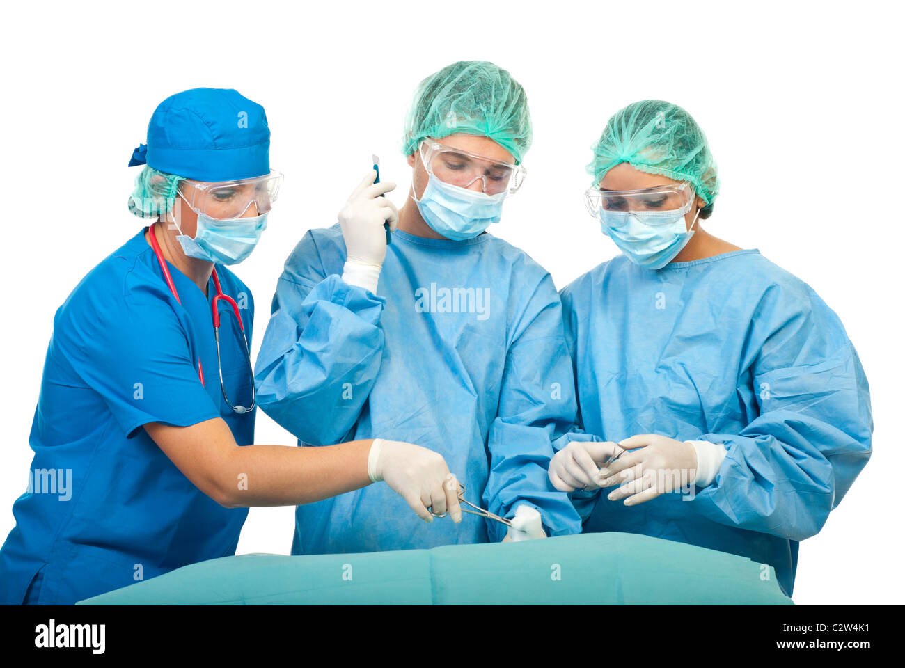 Three surgeons teamwork operating in operation room over white ...
