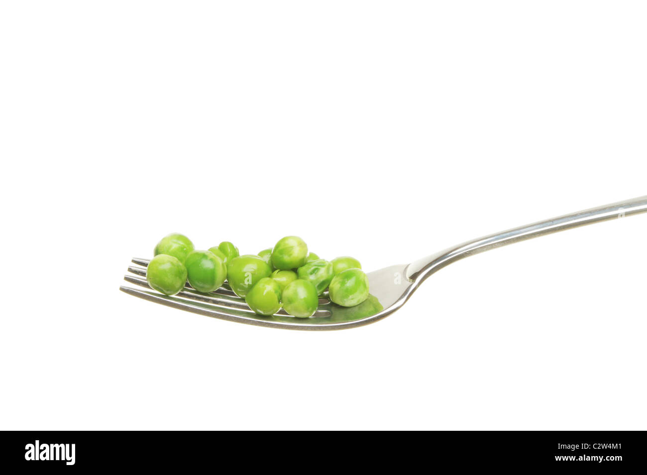 Garden peas on a fork isolated against white Stock Photo - Alamy