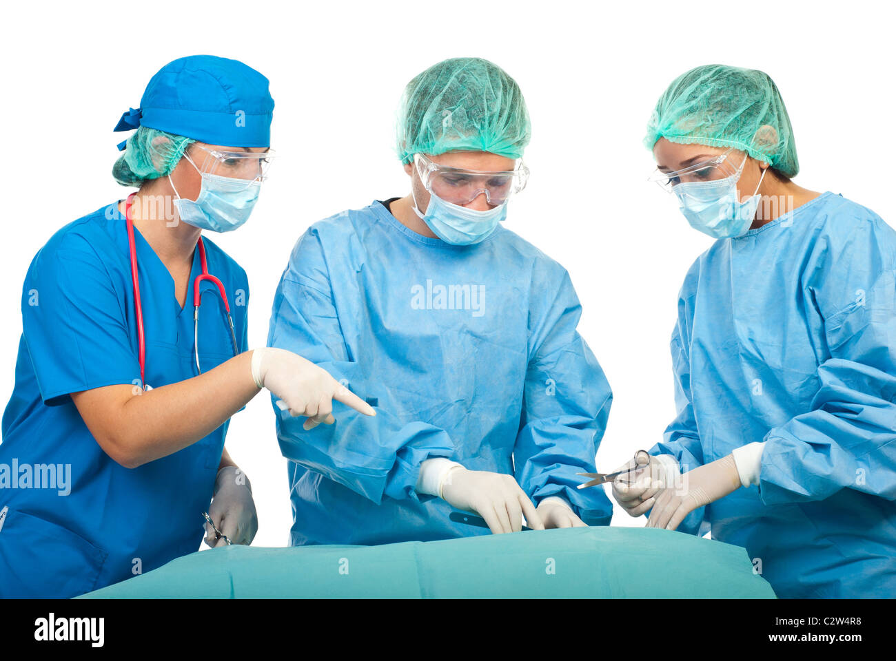 Three surgeons operating in operation room,a surgeon woman showing ...