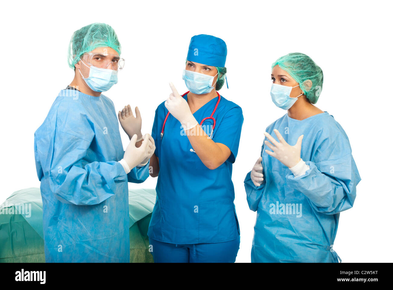 Three surgeons having conversation,a surgeon woman showing something to ...