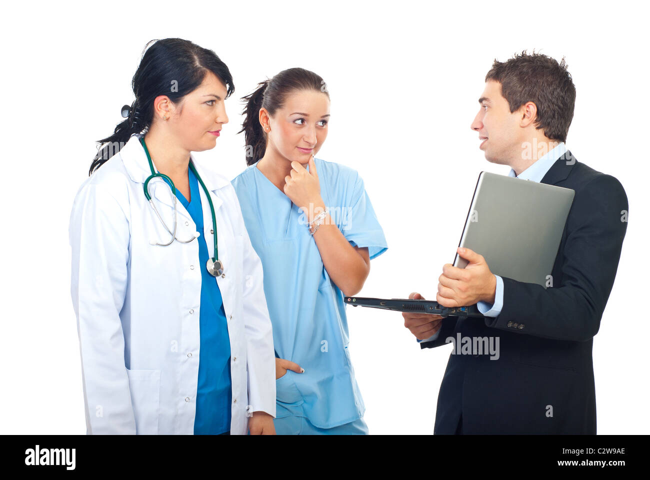 Man holding a laptop and having conversation with two doctors women ...