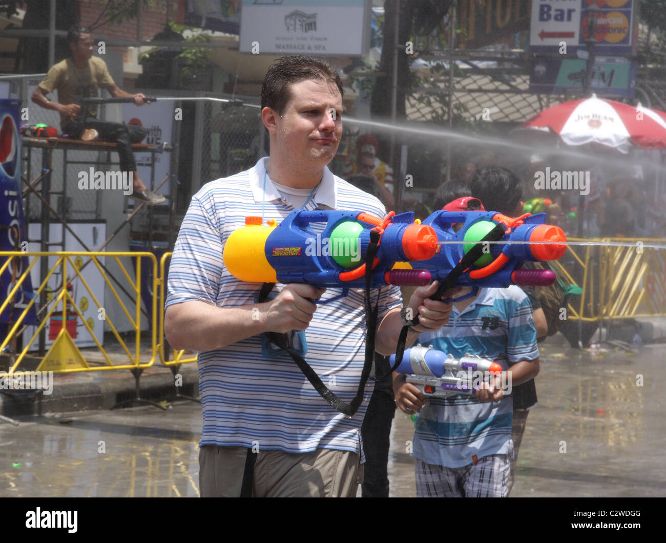 Tourist playing water gun in Songkran festival at Khao san road Stock ...