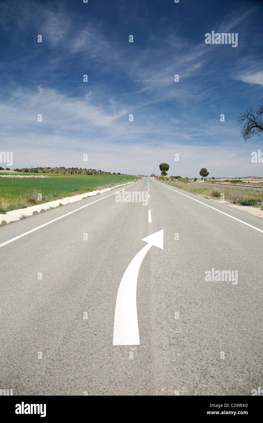 arrow sign painted on the road in spain Stock Photo - Alamy