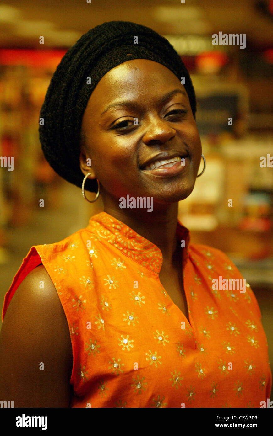 Ugandan singer Omega Bugembe Okello performs and signs copies of her ...