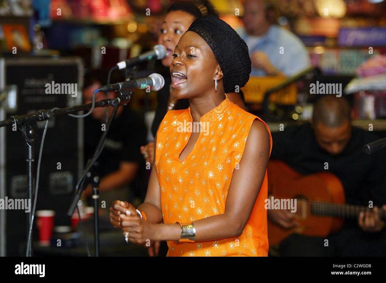Ugandan singer Omega Bugembe Okello performs and signs copies of her ...