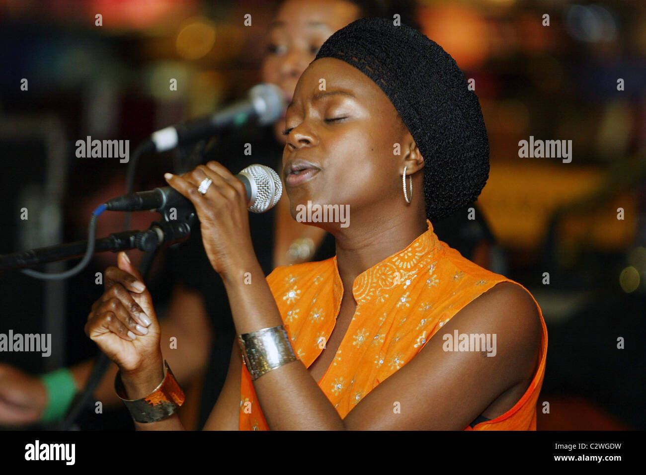 Ugandan singer Omega Bugembe Okello performs and signs copies of her ...