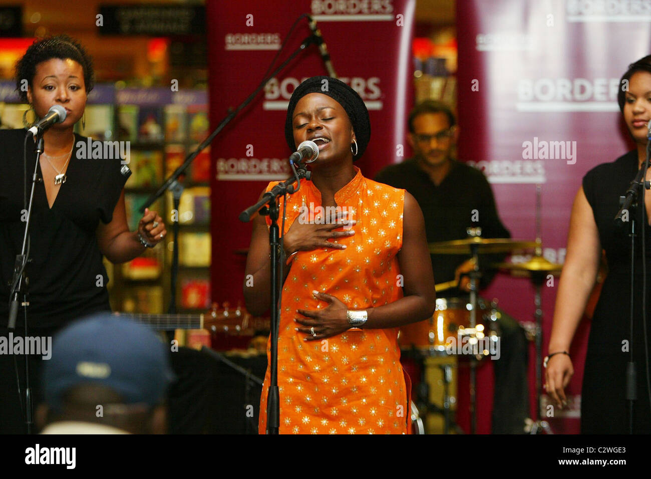 Ugandan singer Omega Bugembe Okello performs and signs copies of her ...