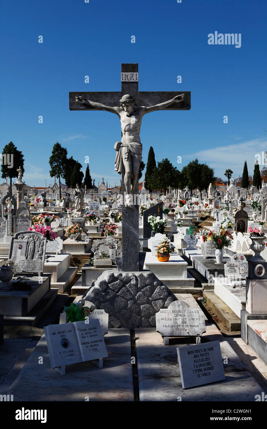 The crucified figure of Jesus Christ adorns a gravestone in a Portuguese cemetery Stock Photo ...