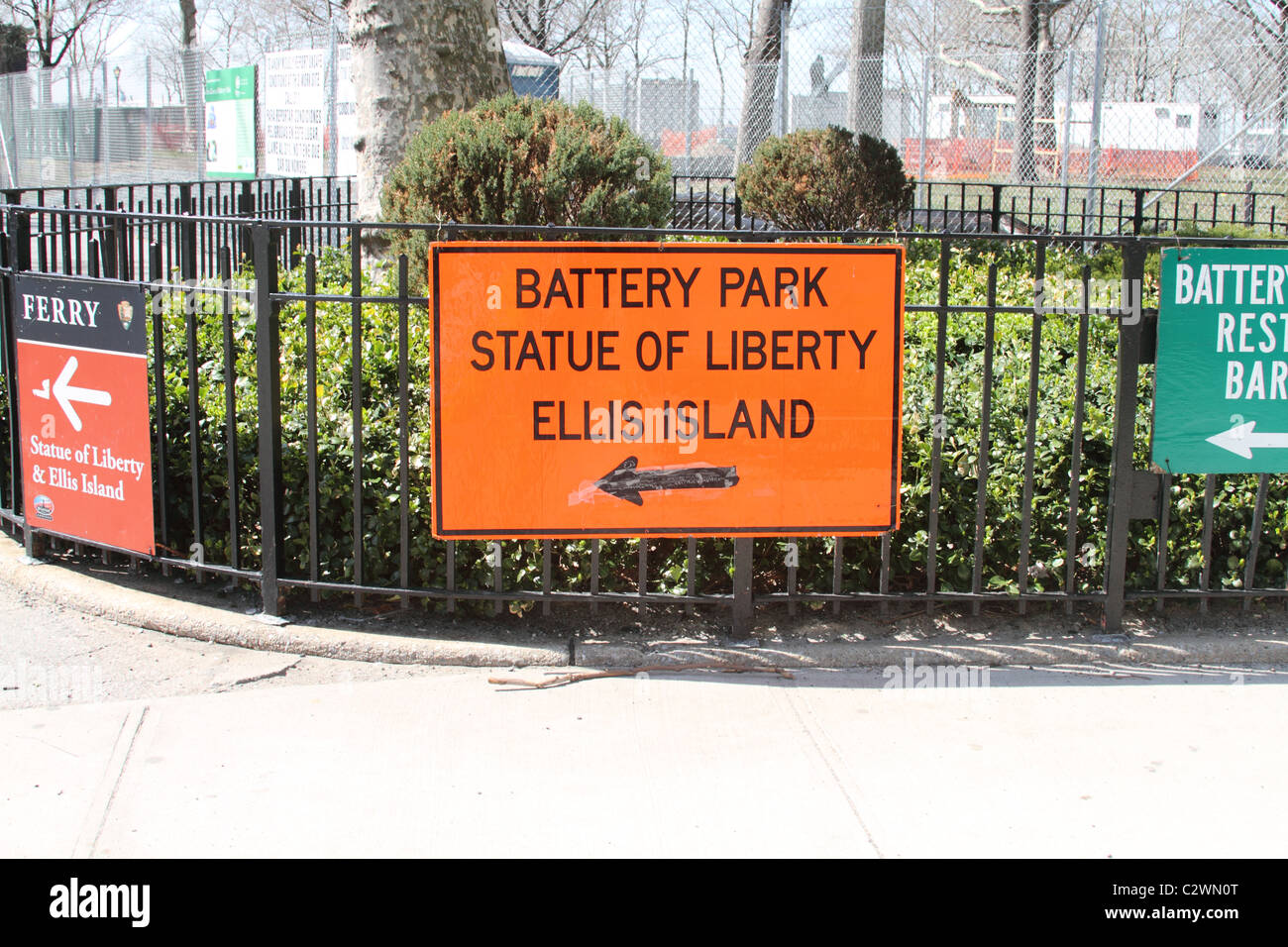 Battery Park Statue of Liberty and Ellis Island sign Stock Photo - Alamy
