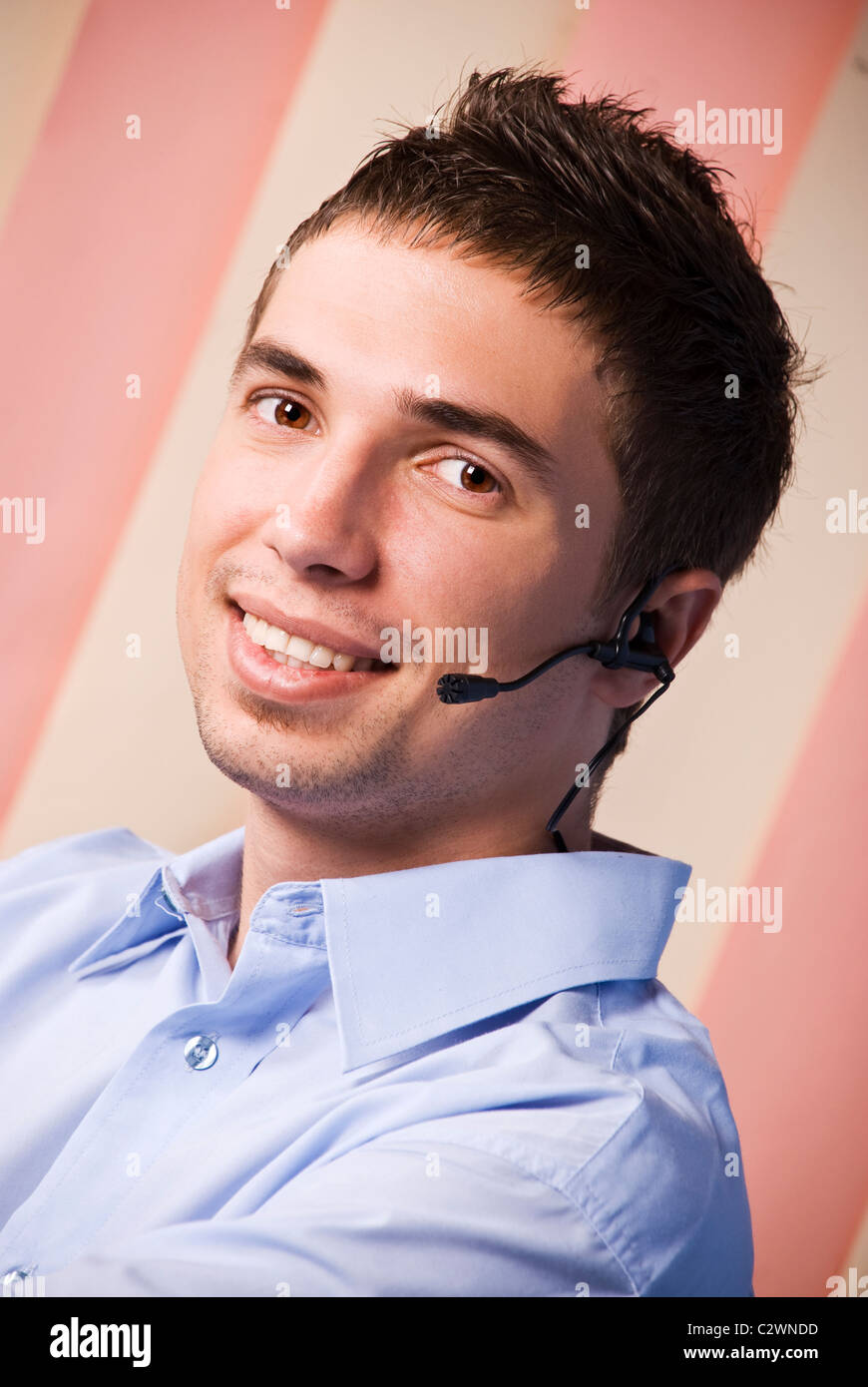 Portrait of customer service operator male smiling and looking you ...
