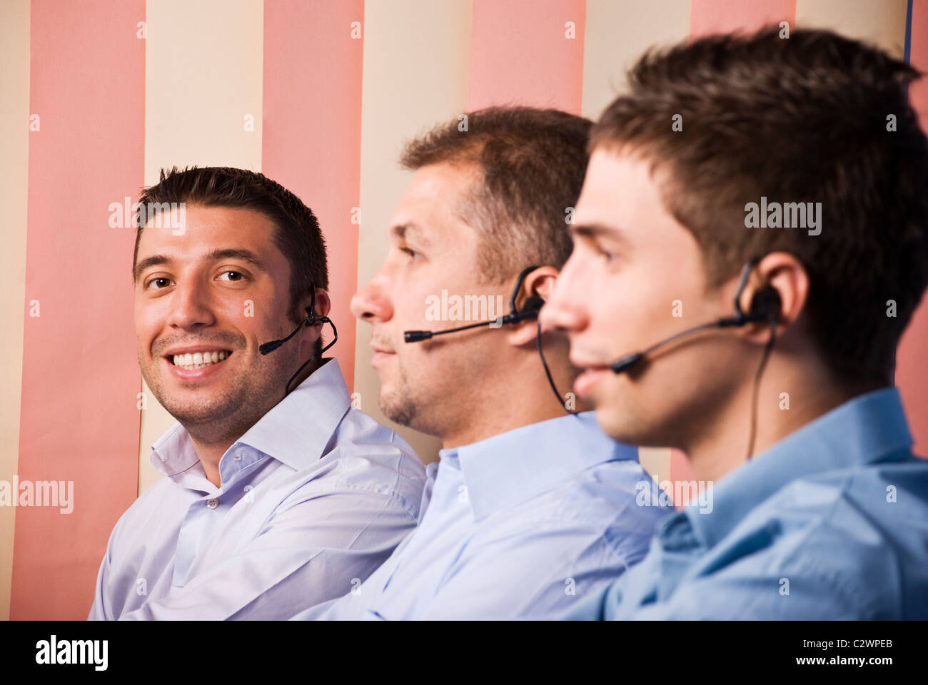 Teamwork men of customer service representative,focus on last man that ...