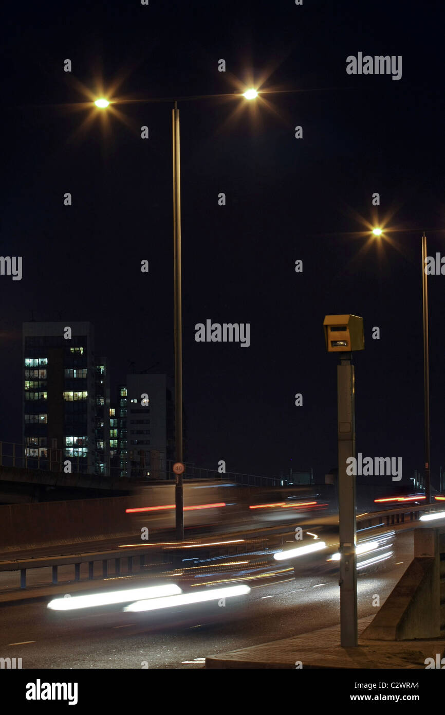 light trails of vehicles passing a GATSO or speed camera at night on ...