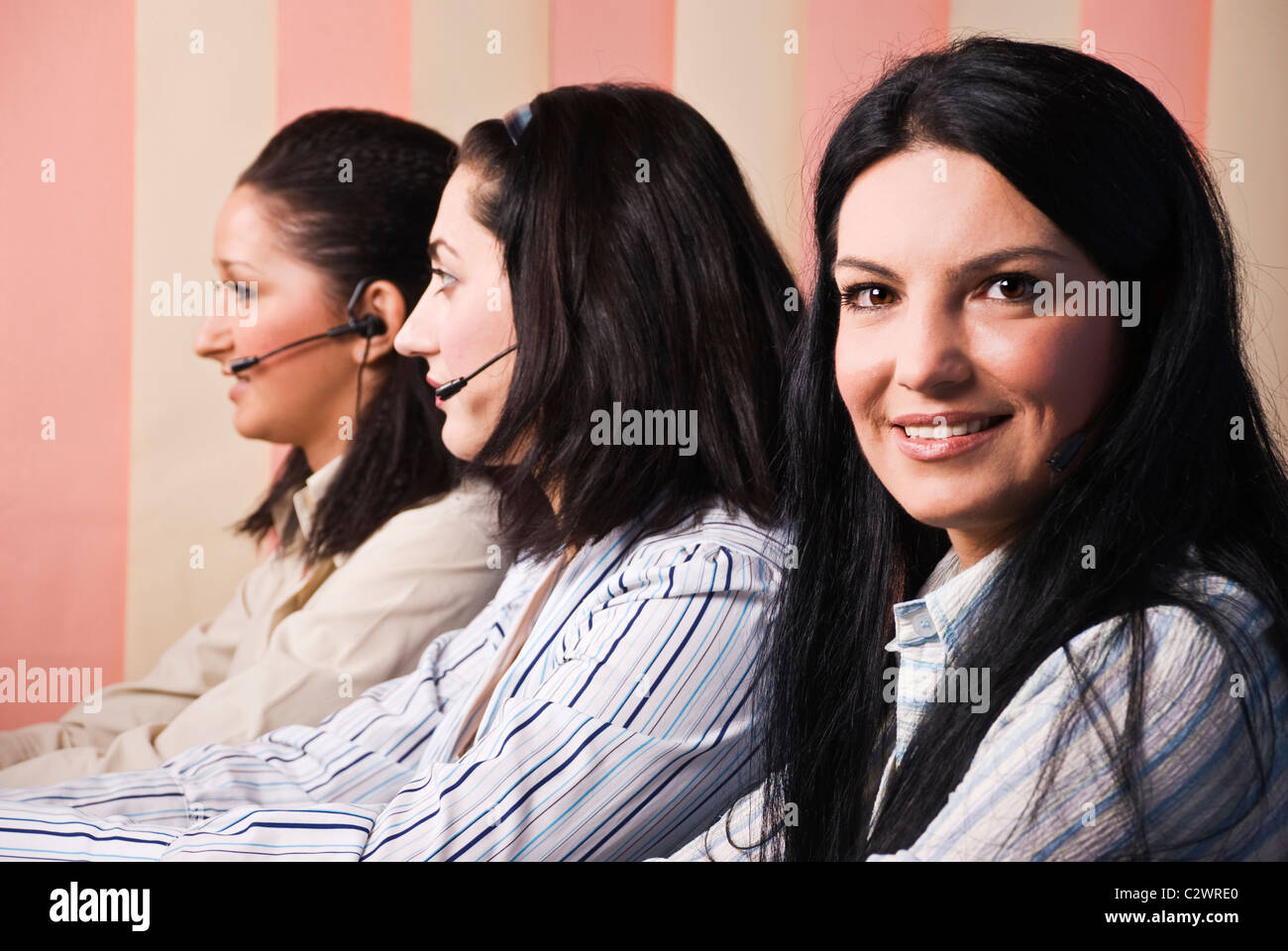 Friendly team of customer service team standing in line,focus on first ...