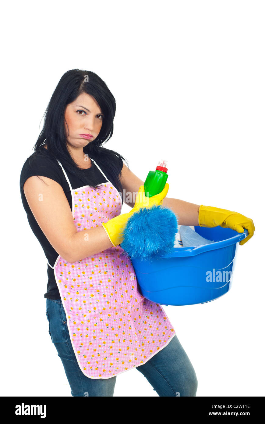 Miffed woman holding cleaning products isolated on white background ...