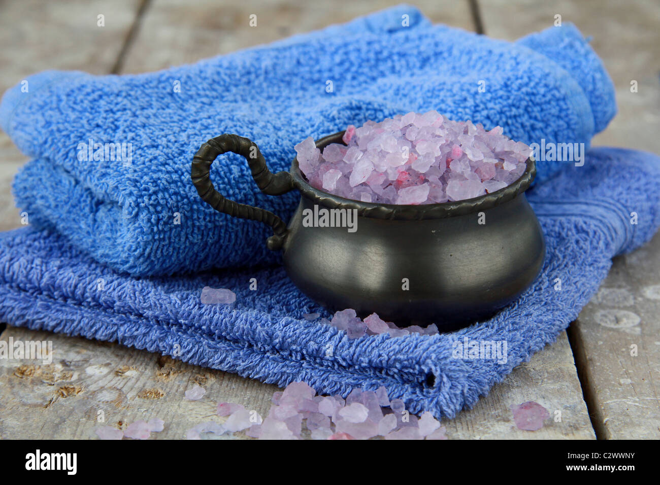 Spa still life .Bath lilac salt, towel and flowers Stock Photo - Alamy
