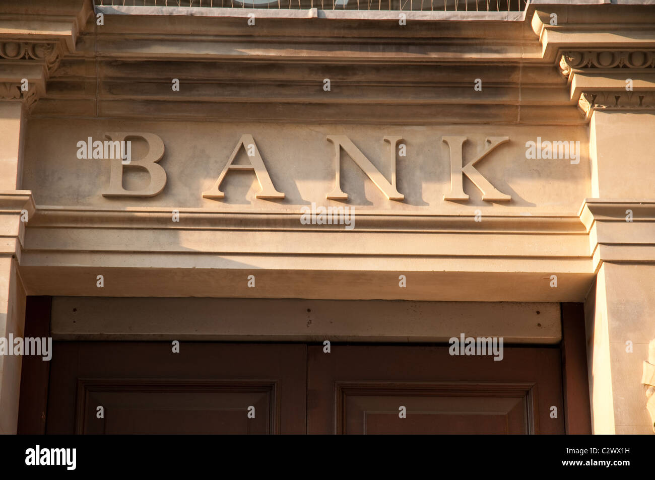 Carved stone Bank sign Stock Photo - Alamy