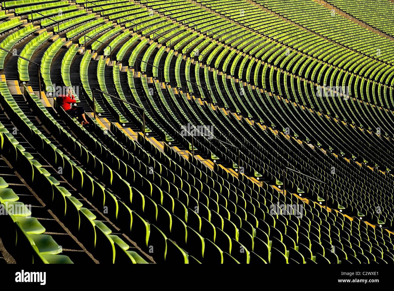 Germany Bavaria Munich Olympic Stadium curved section of bright green ...