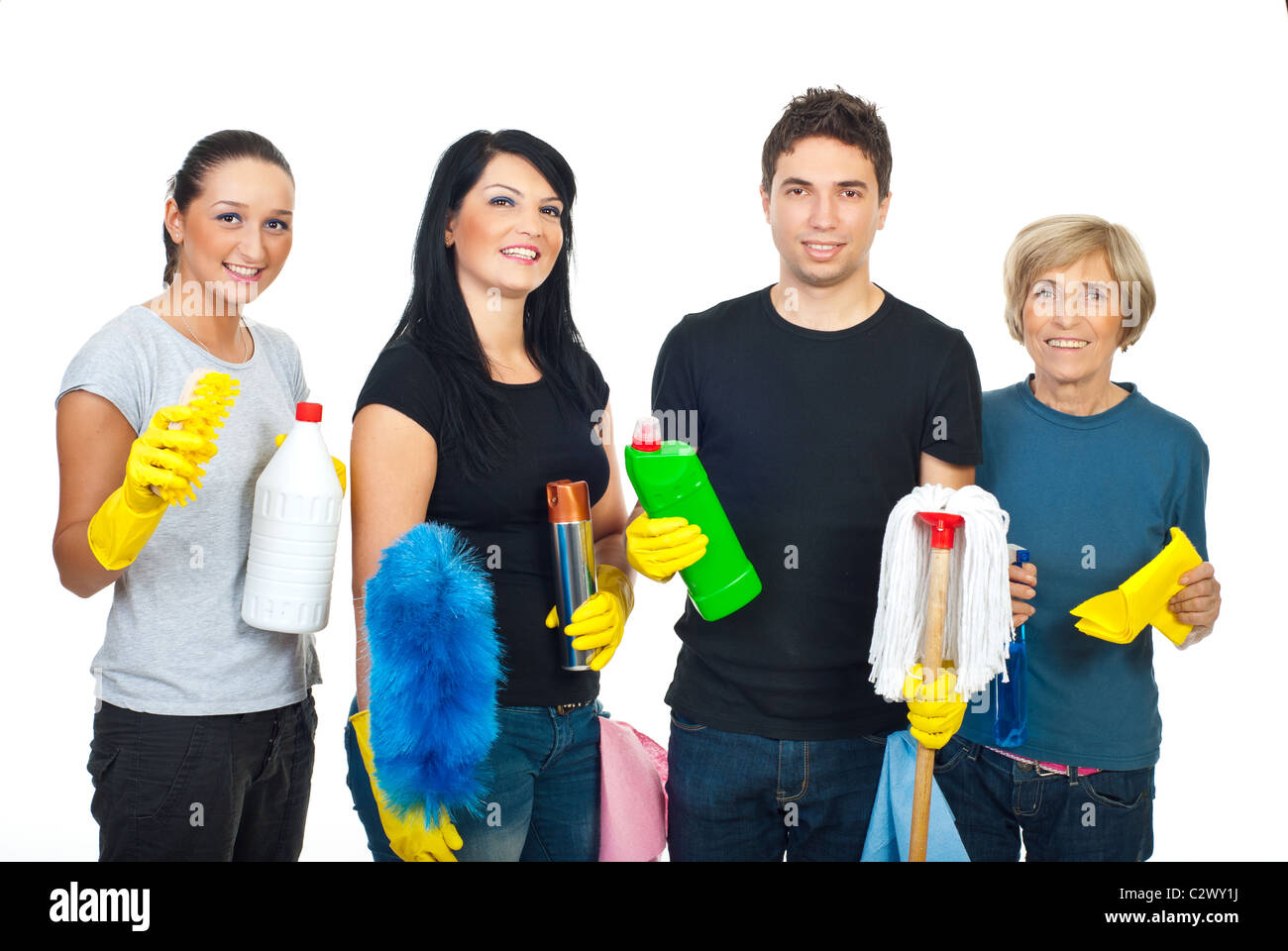 Happy team of cleaning workers holding cleaning products and their ...