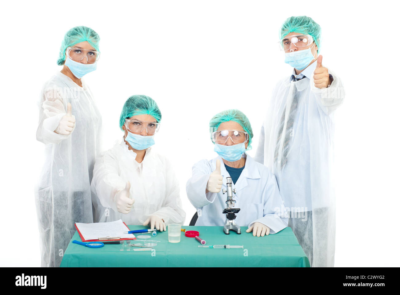 Successful team of scientists people giving thumbs up on laboratory ...