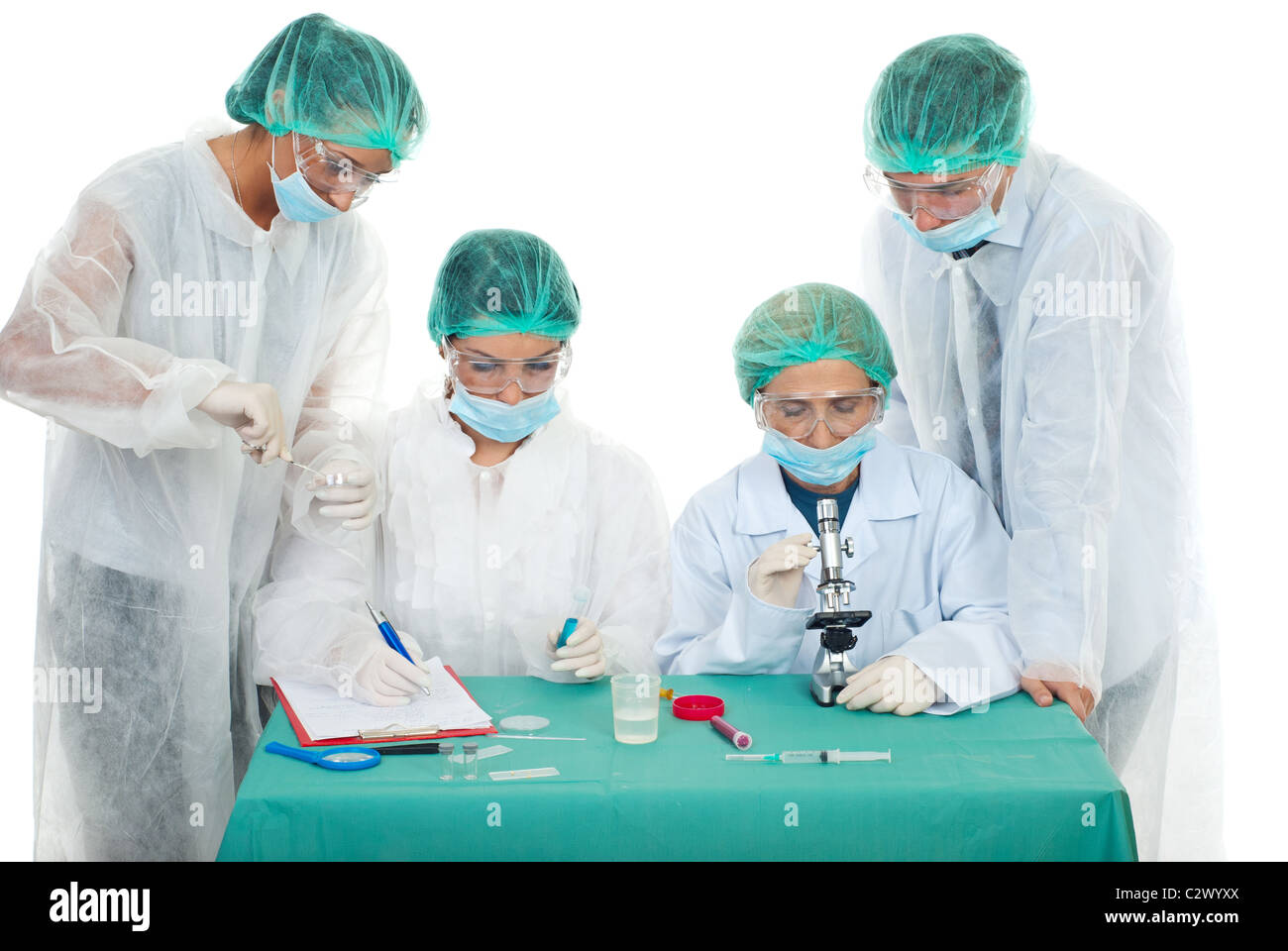 Four people researchers teamwork working in laboratory Stock Photo - Alamy