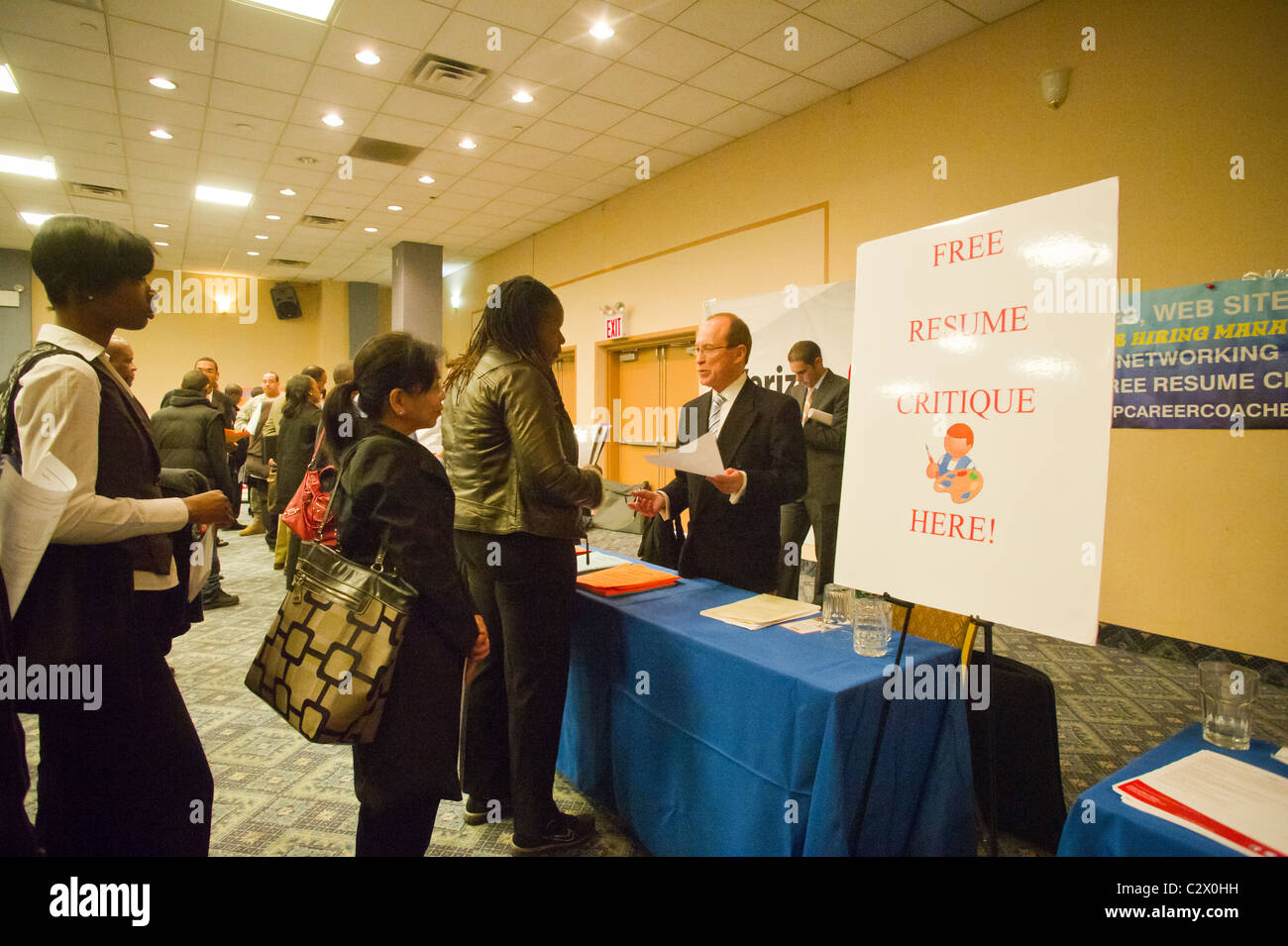 Job seekers line up for a job fair in midtown in New York on Monday ...