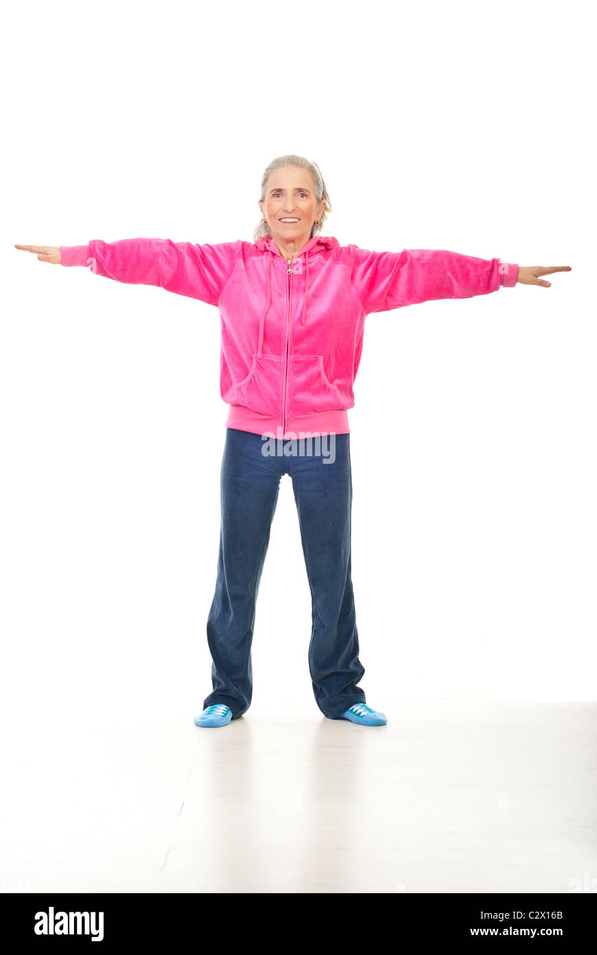 Active smiling senior woman doing sport over white background Stock ...