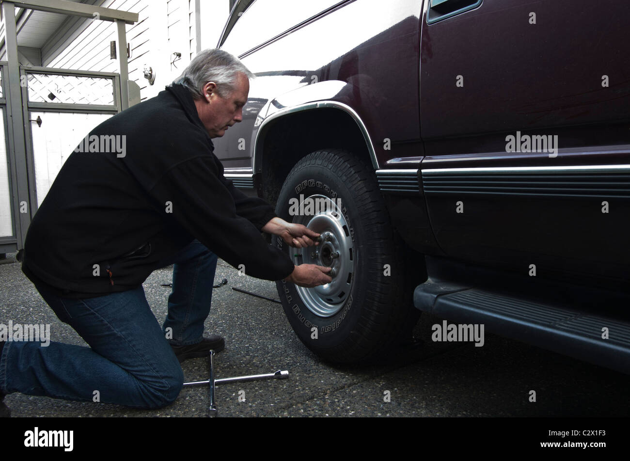 Man preparing remove tire on hi-res stock photography and images - Alamy