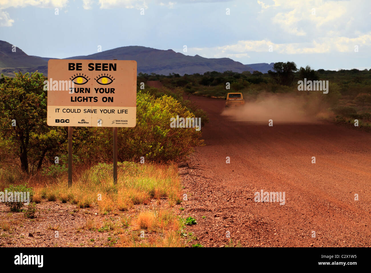 Turn your lights on road warning sign, Pilbara, Northwest Australia ...