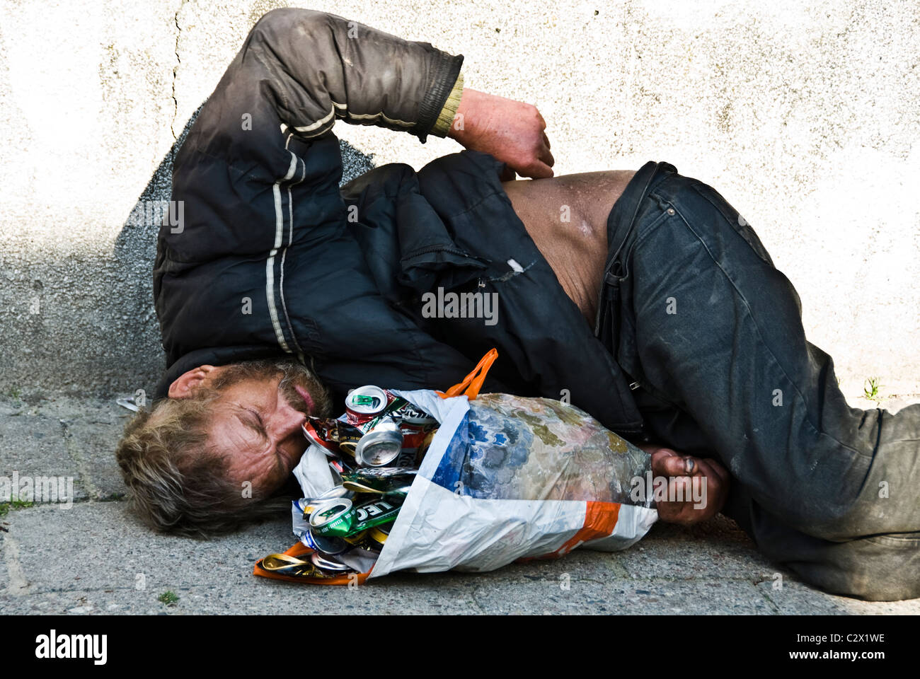 Homeless sleeping on the street, Warsaw, Poland Stock Photo - Alamy