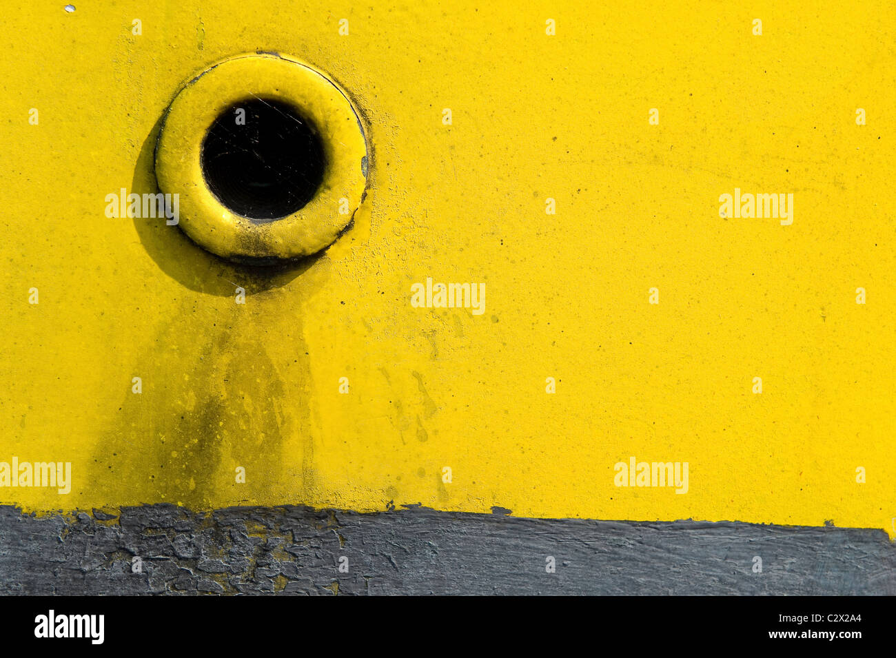 Close-up of a boat overflow outlet in a small fishing boat grounded at ...