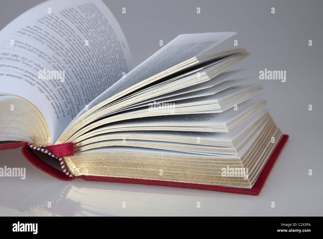 Open book with gold pages Stock Photo - Alamy