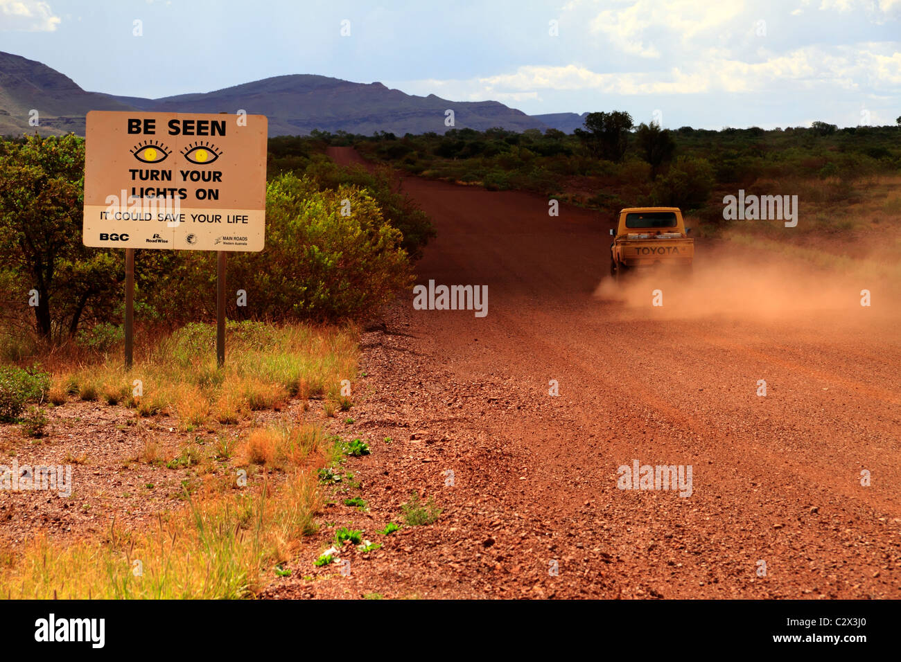 Turn your lights on road warning sign, Pilbara, Northwest Australia ...