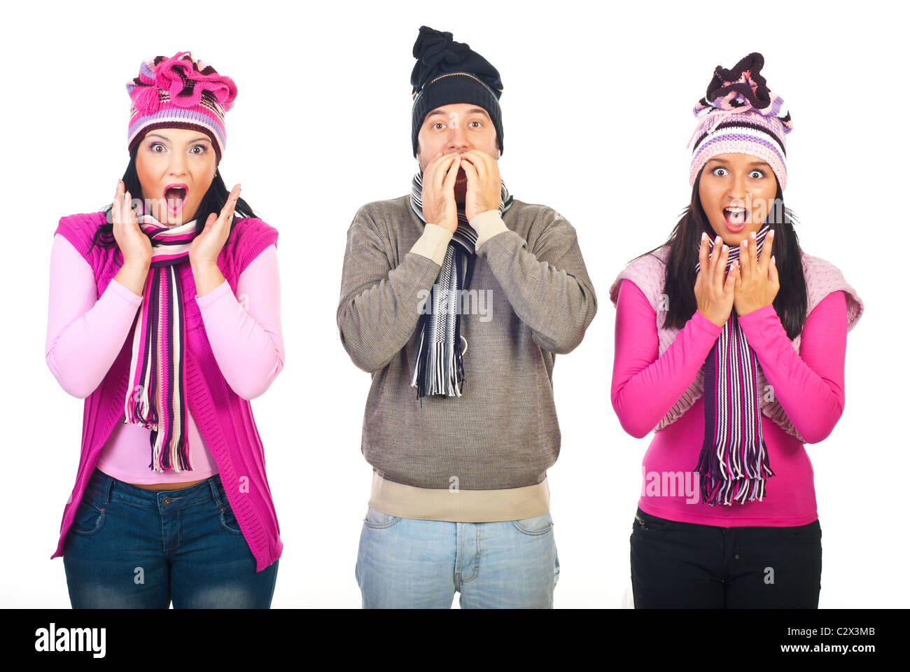 Three shocked friends standing in a row and shouting isolated on white ...