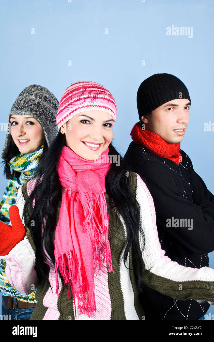 Happy group of friends wearing winter clothes they standing close each ...