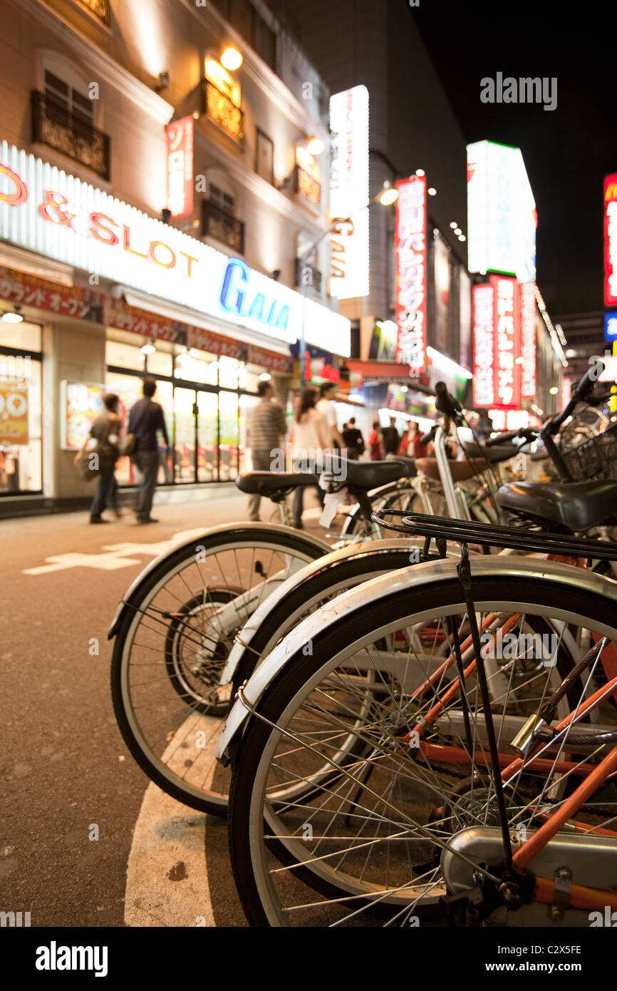 BICYCLES ON A BIKE RACK AT NIGHT ON A STREET IN TOKYO JAPAN Stock Photo ...