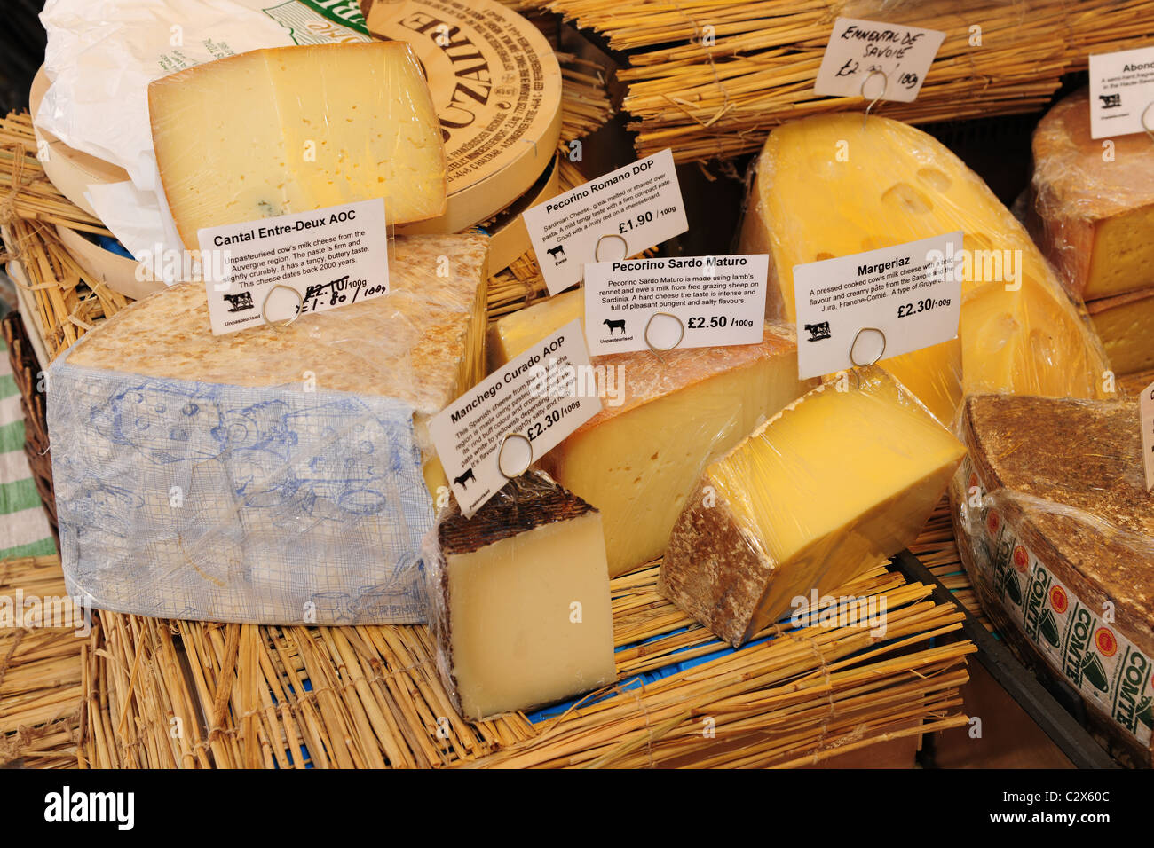 Cheese on a market traders stall. With permission Stock Photo - Alamy