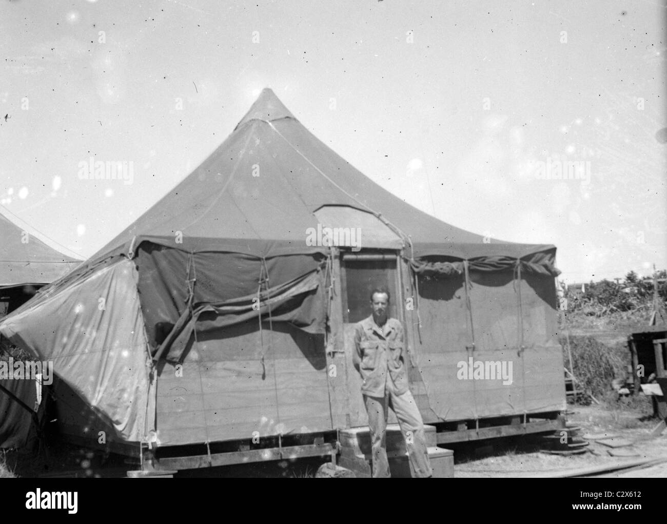 American GI standing next to tent in photograph made on Okinawa in ...
