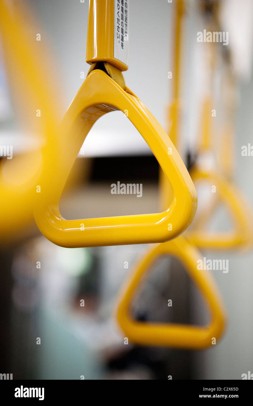 yellow train handle on a train in japan Stock Photo - Alamy