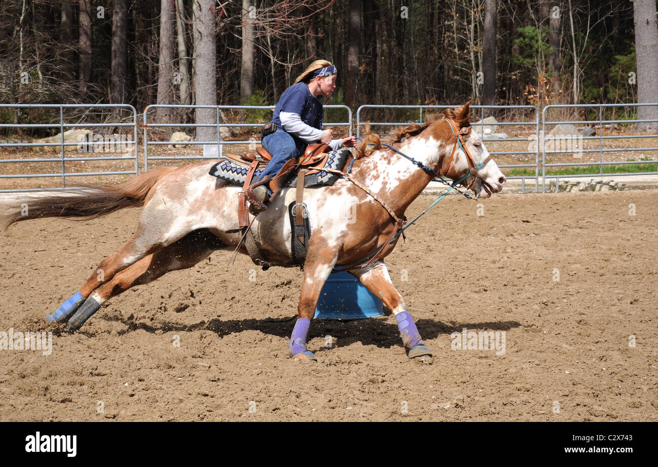 Young blond woman barrel racing Stock Photo - Alamy